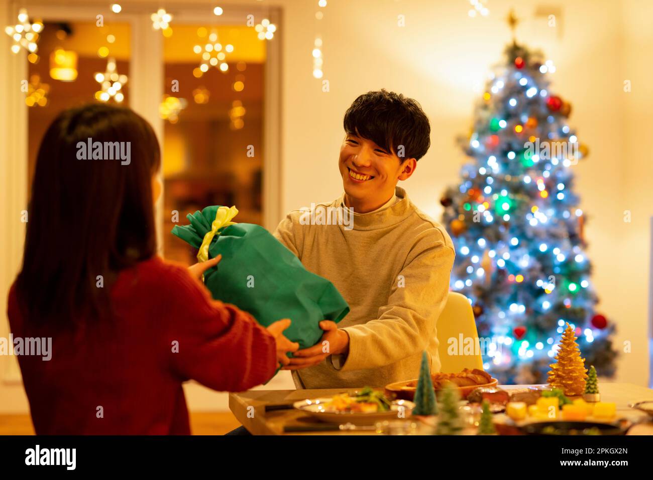 Giving presents couple hi-res stock photography and images - Alamy