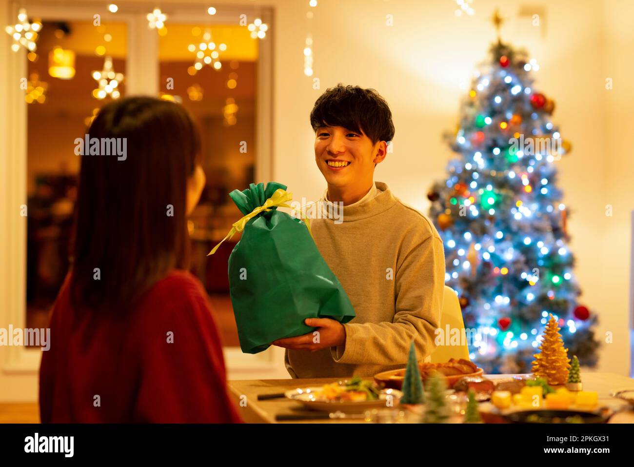 Giving presents couple hi-res stock photography and images - Alamy