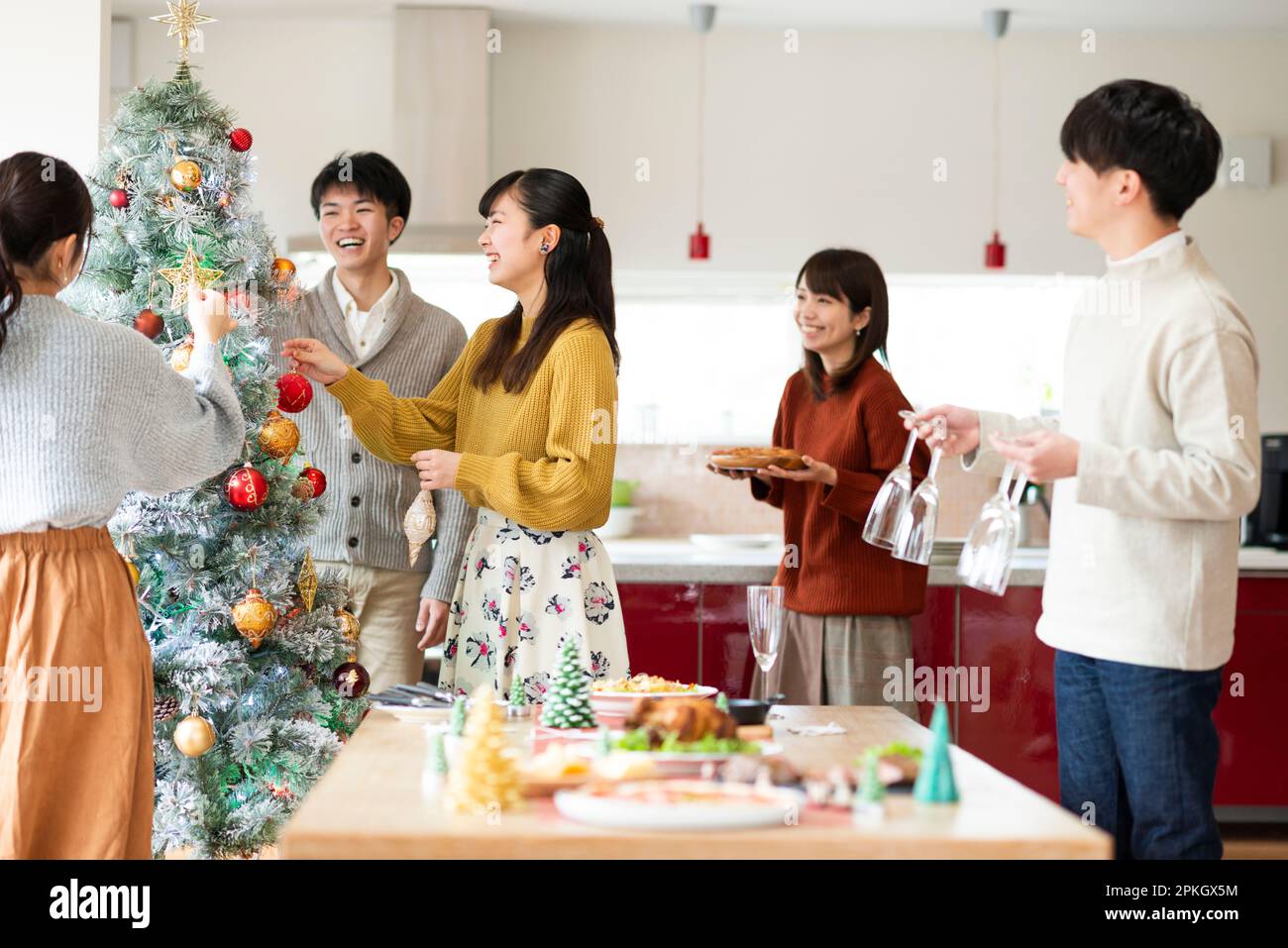 Young people preparing for a Christmas party Stock Photo - Alamy