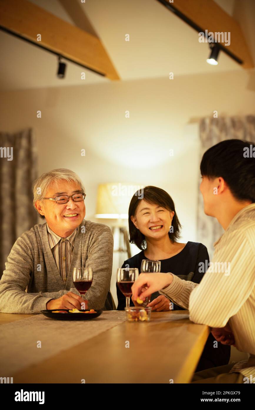 Parent and child drinking wine Stock Photo - Alamy