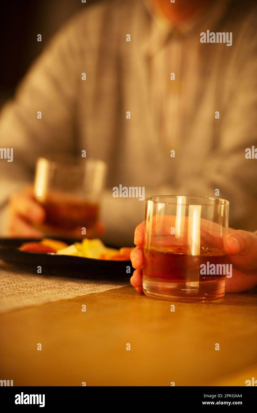 A hand drinking whiskey Stock Photo - Alamy