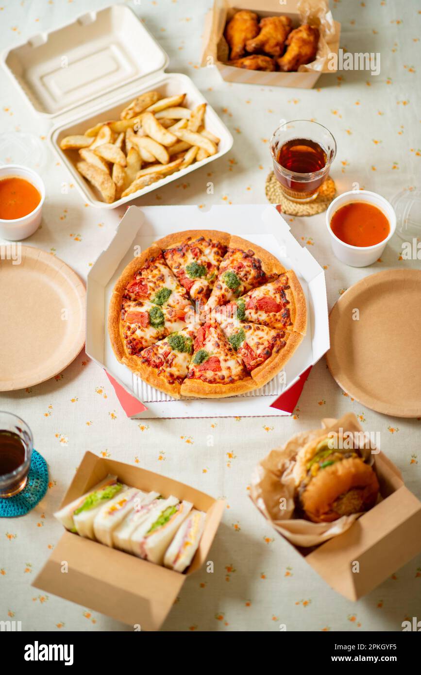 Dining table with takeout Stock Photo - Alamy