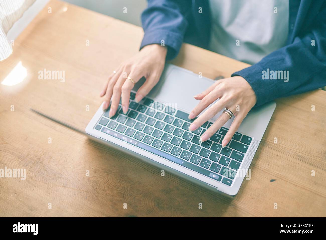 Woman operating laptop hi-res stock photography and images - Alamy