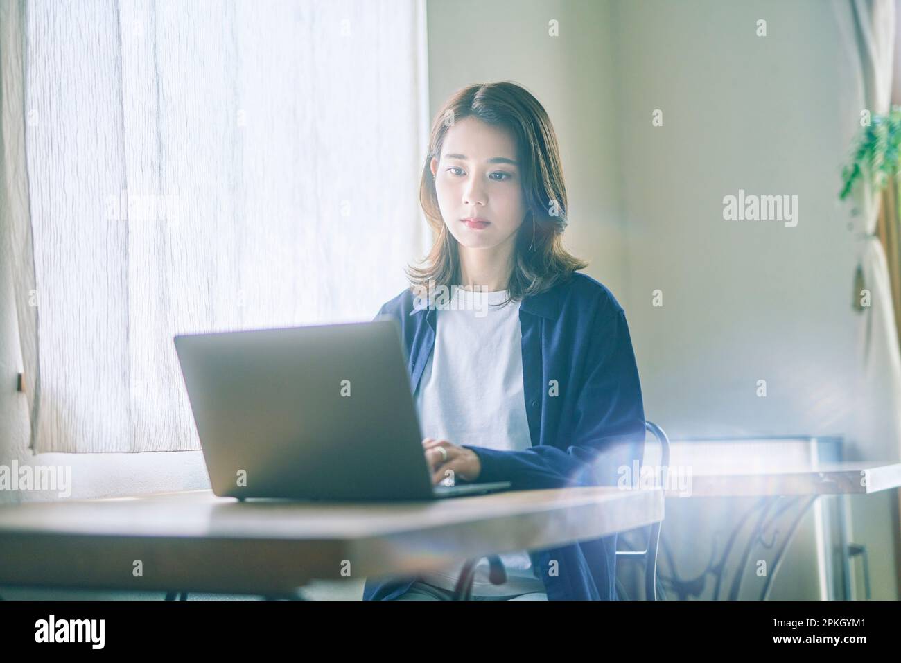 Young girl operating computer hi-res stock photography and images - Alamy