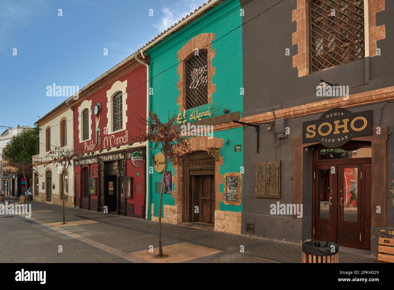 Typical street of the Sea with the facades of shops of colors in Denia ...