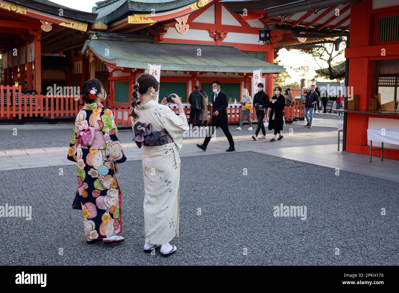 Kyoto, Japan. 6th Mar, 2023. Two women in kimono touring Mt. Inari ...