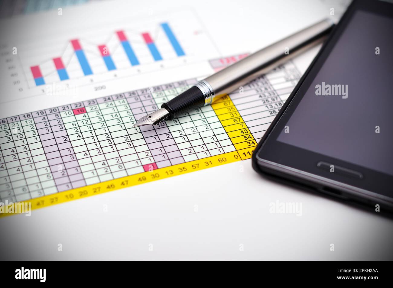 Financial graphs and charts with phone Stock Photo - Alamy
