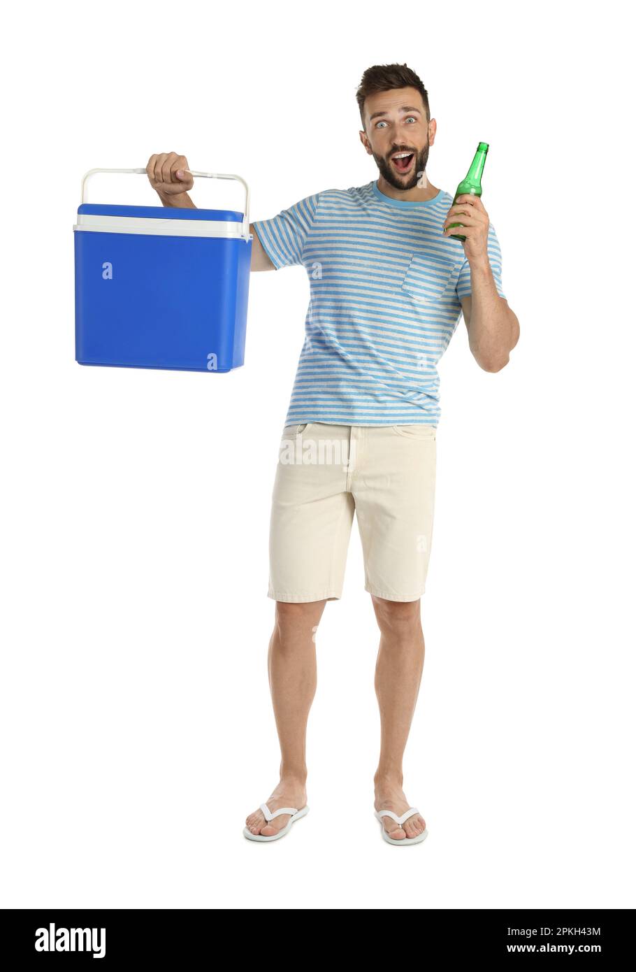 Emotional man with cool box and bottle of beer on white background ...