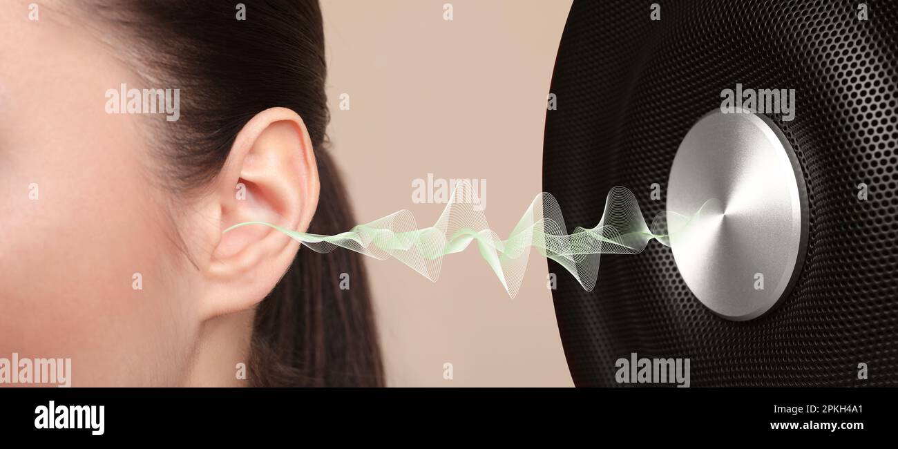 Modern audio speaker and woman listening to music on beige background ...