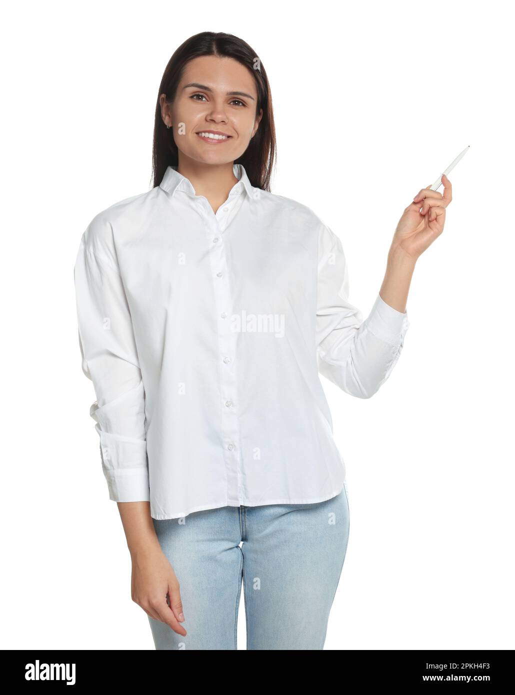 Beautiful young woman pointing at something with pen on white ...