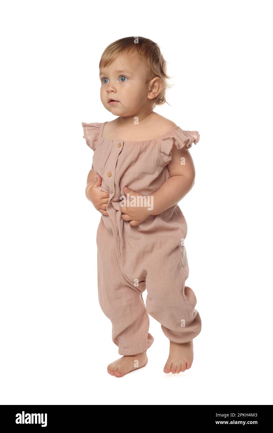 Cute baby girl learning to walk on white background Stock Photo - Alamy