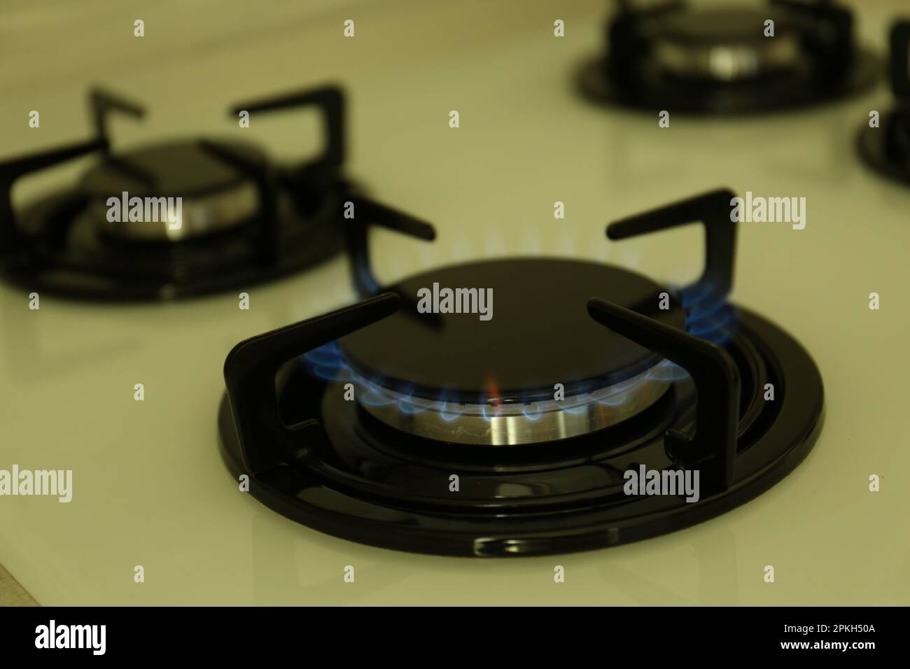 Gas burner of modern stove with burning blue flame, closeup Stock Photo ...