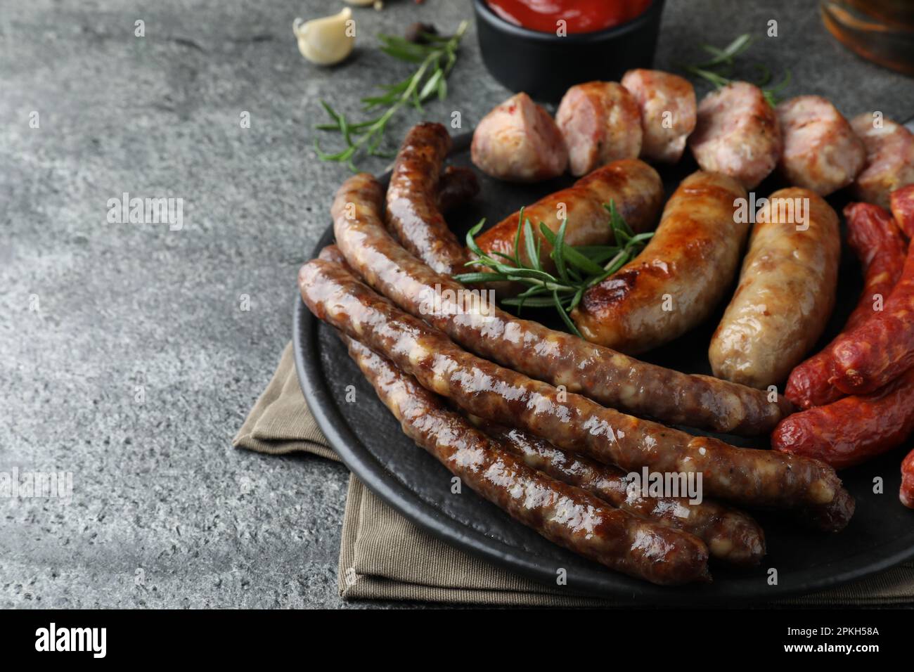 Set of different tasty snacks on dark grey table, space for text Stock ...