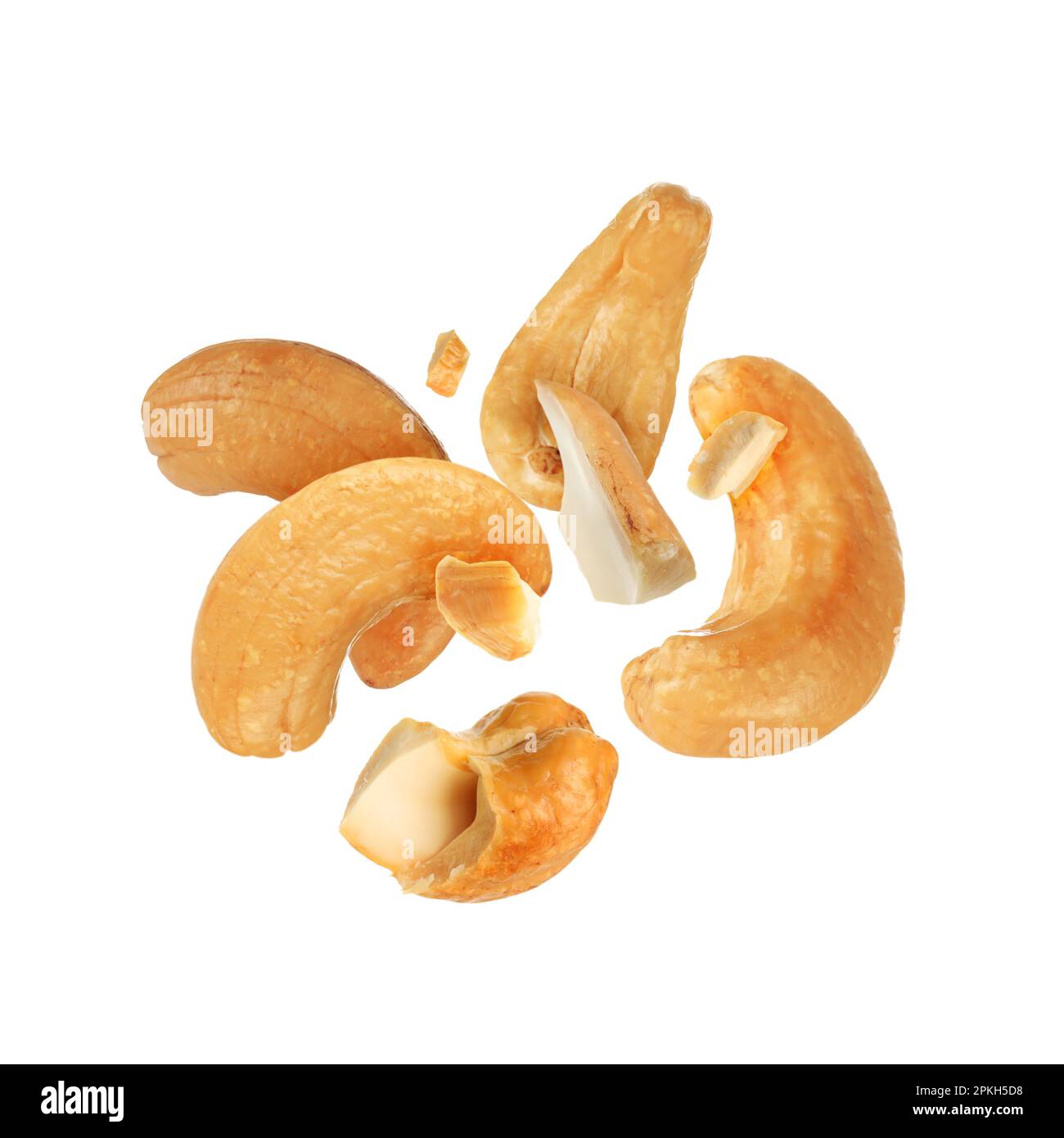 Tasty cashew nuts flying on white background Stock Photo - Alamy