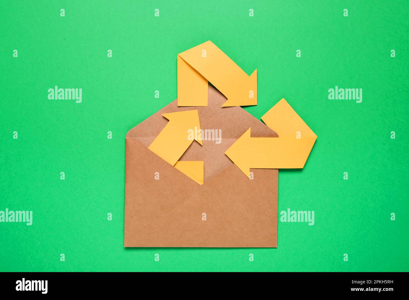 Open envelope and recycling symbol on green background, top view Stock ...