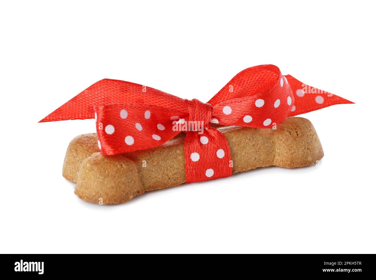 Bone shaped dog cookie with red bow isolated on white Stock Photo - Alamy