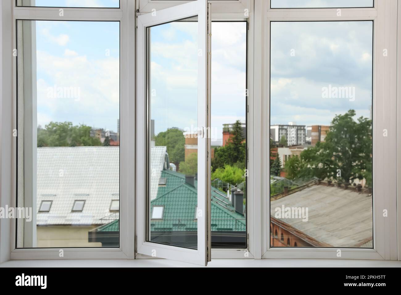 Open window with white plastic frame indoors Stock Photo - Alamy