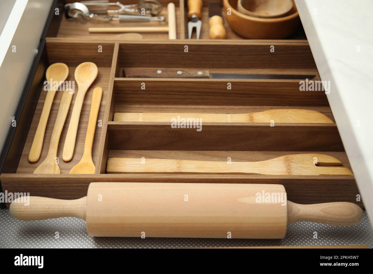 Open drawer of kitchen cabinet with different utensils, closeup Stock ...