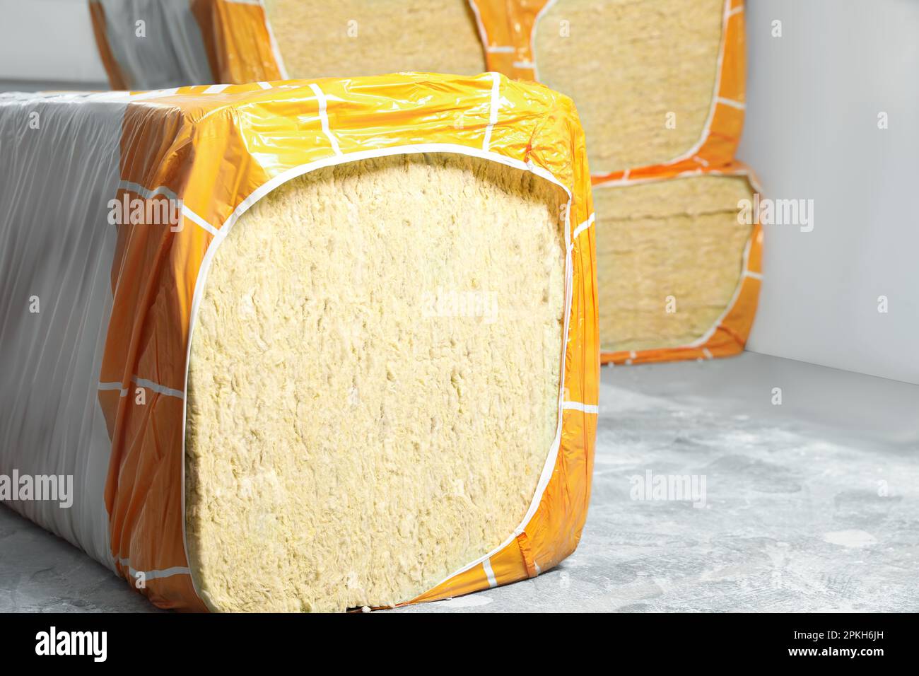 Packages of thermal insulation material in room, closeup. Space for ...
