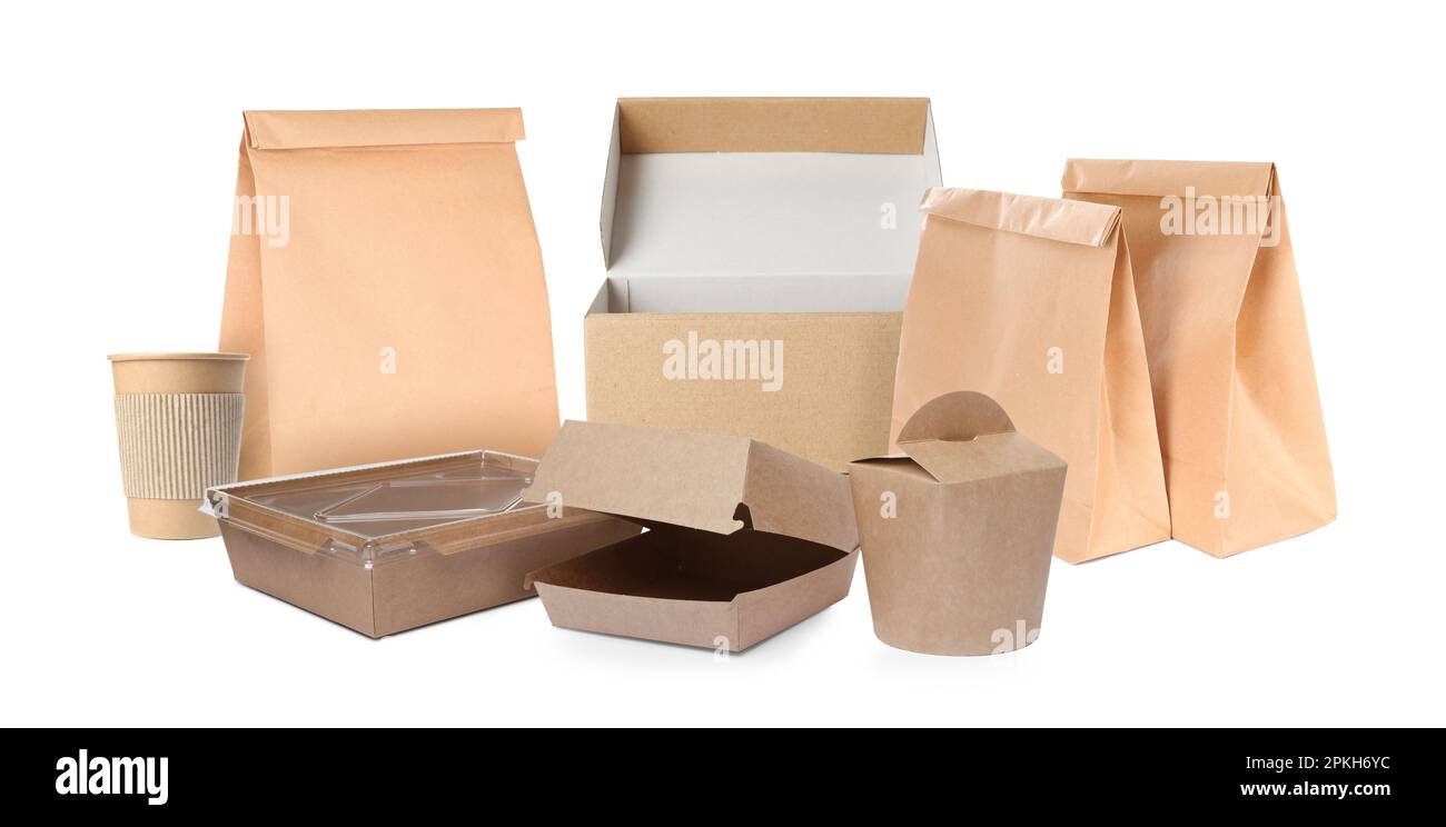 Set with different paper bags and containers for food on white ...