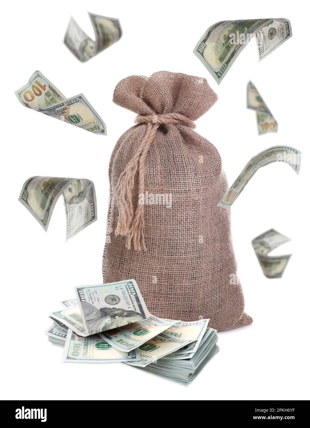 Burlap bag and flying dollar banknotes on white background Stock Photo ...