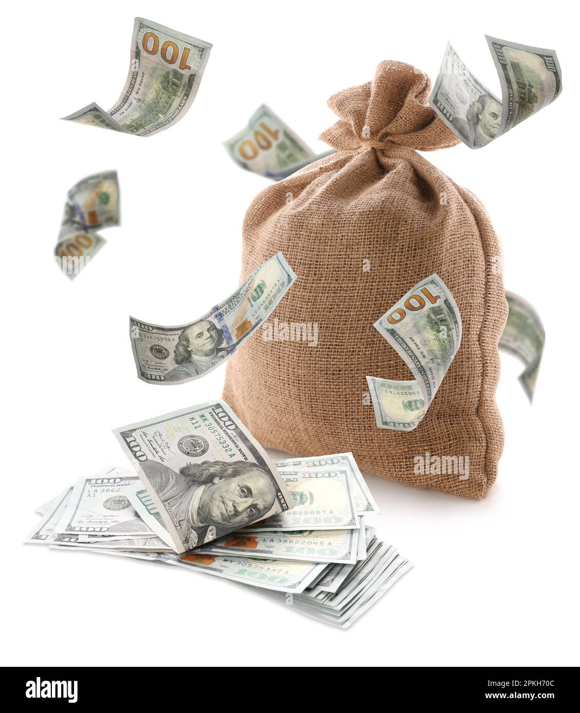Burlap bag and flying dollar banknotes on white background Stock Photo ...