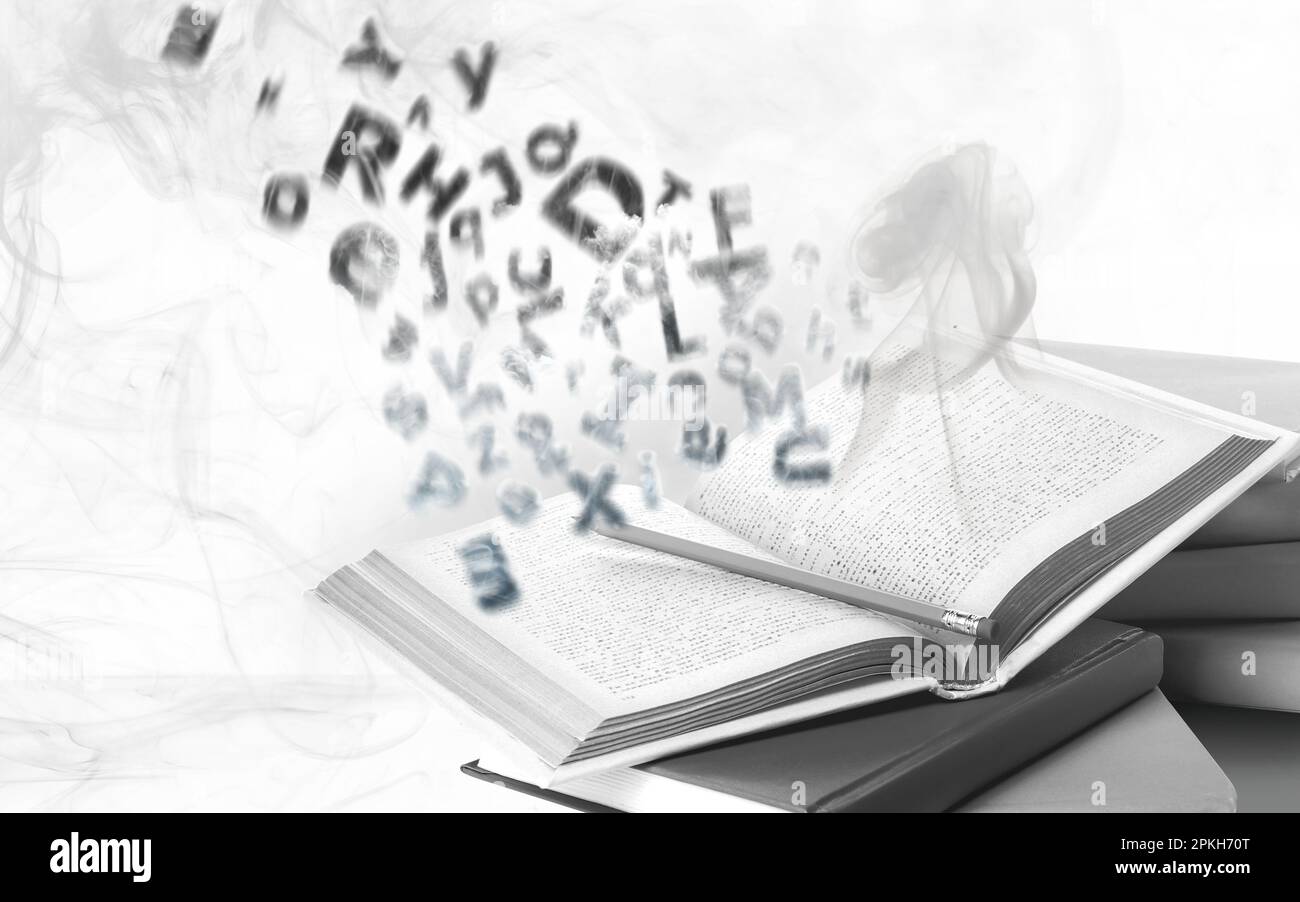 Open book with flying letters on white background. Dyslexia concept ...