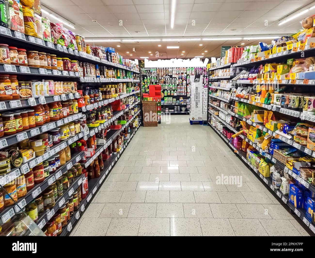 HUETTENBERG, HESSE, GERMANY 12 05 2022: Aisle with shelfes full of food ...