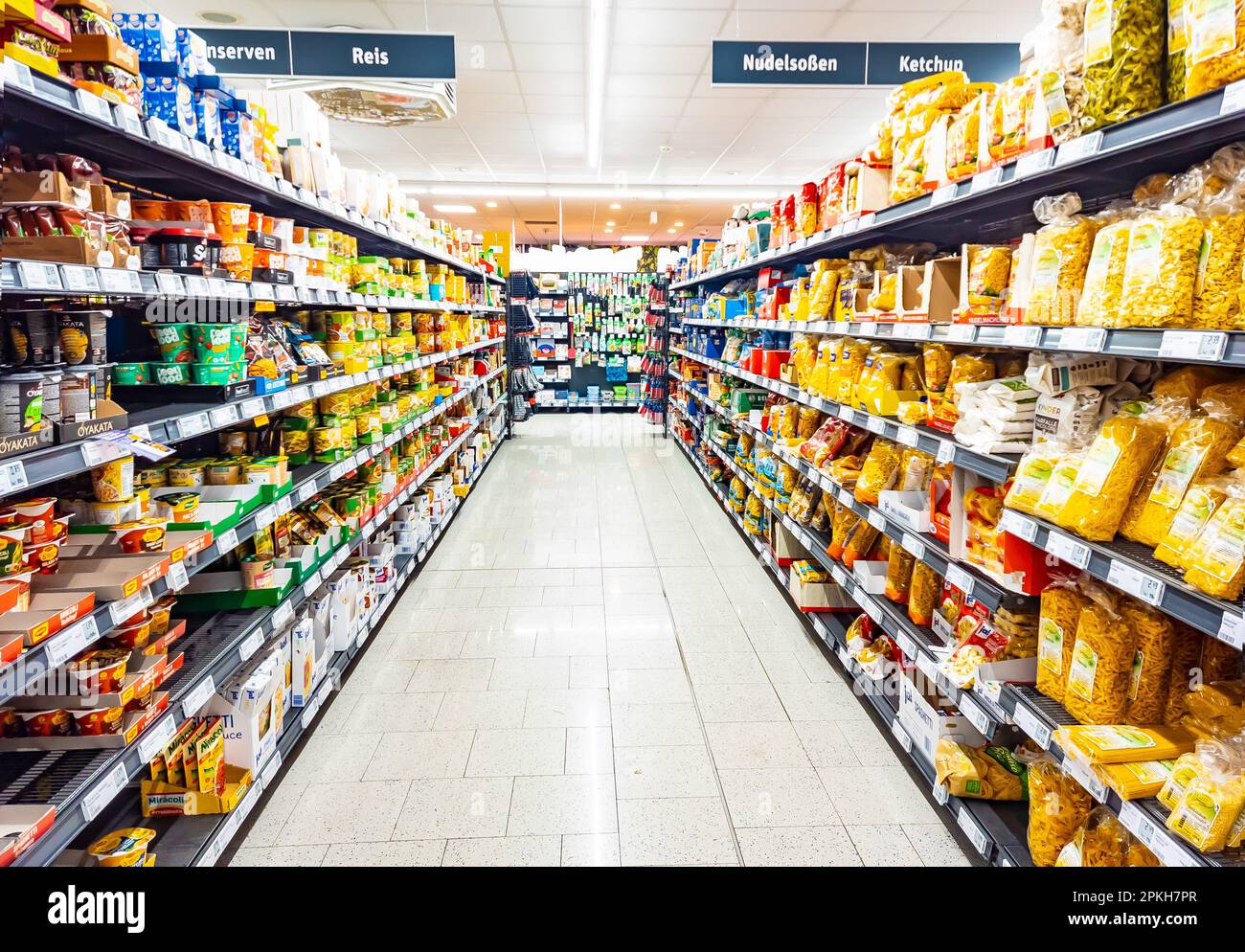 HUETTENBERG, HESSE, GERMANY 12 05 2022: Aisle with shelfes full of food ...