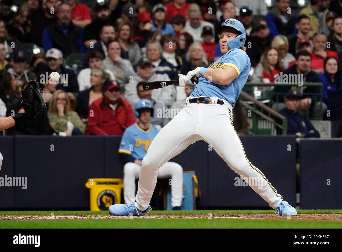 Milwaukee Brewers' Joey Wiemer leans back to avoid being hit by a St ...