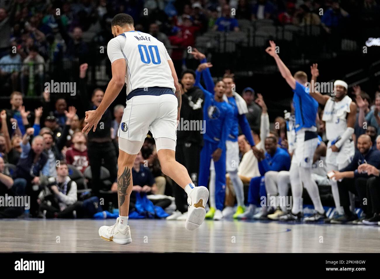 Dallas Mavericks center JaVale McGee (00) celebrates after sinking a 3 ...