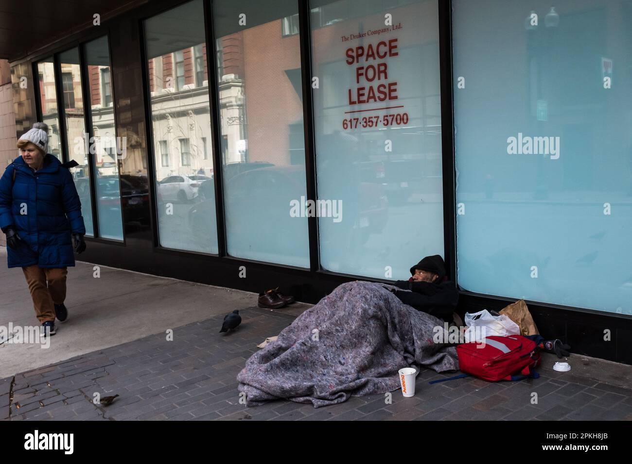 Boston, USA. 7 Mar, 2023. A person sleeping on the sidewalk in the ...