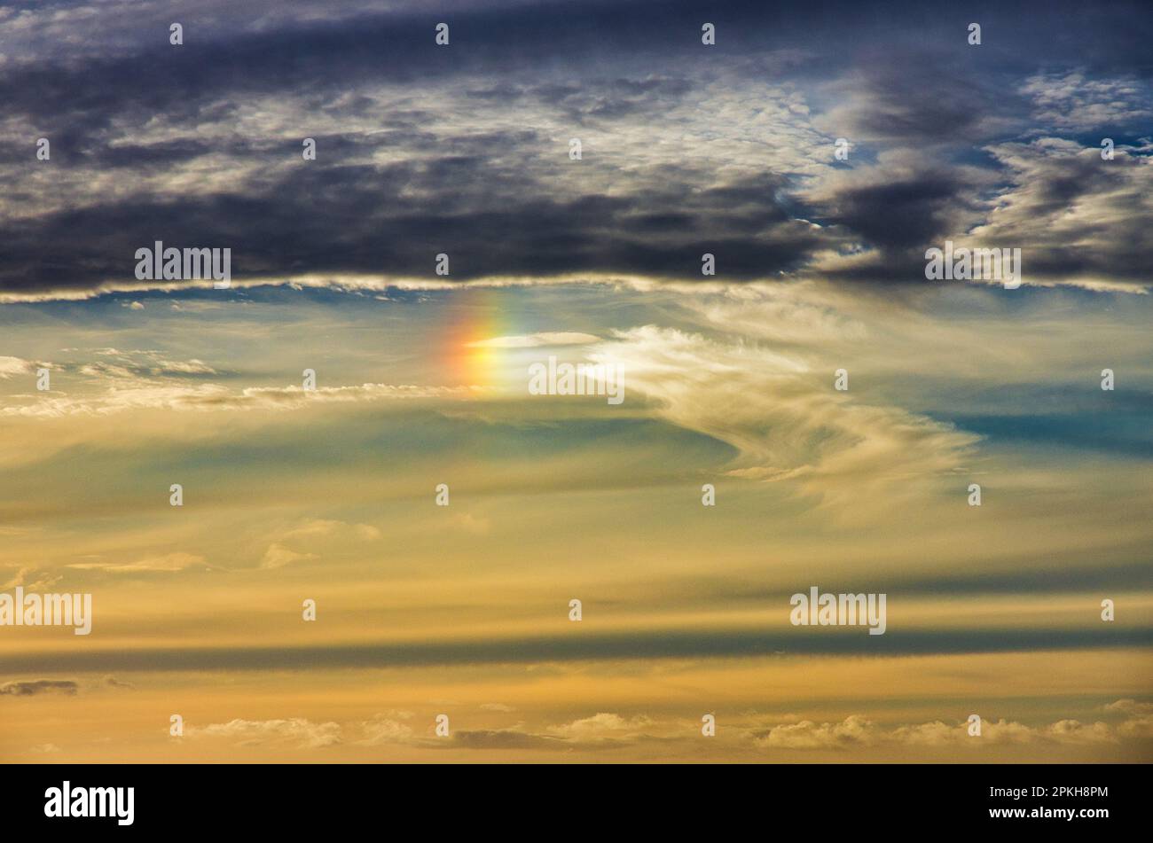 Sunset sky with burst of rainbow light Stock Photo - Alamy