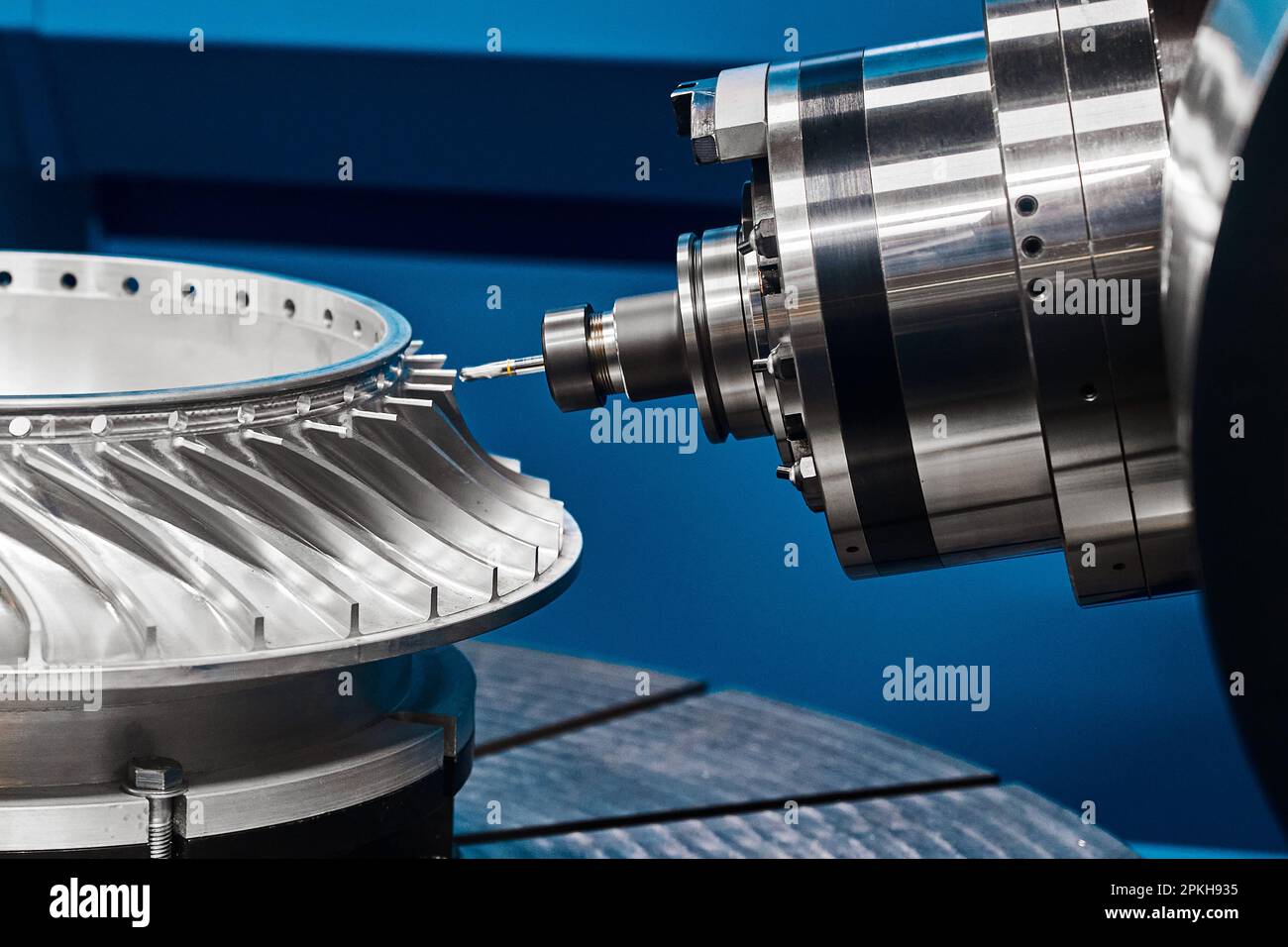 Producing turbine wheel part with five-axis lathe machine Stock Photo - Alamy