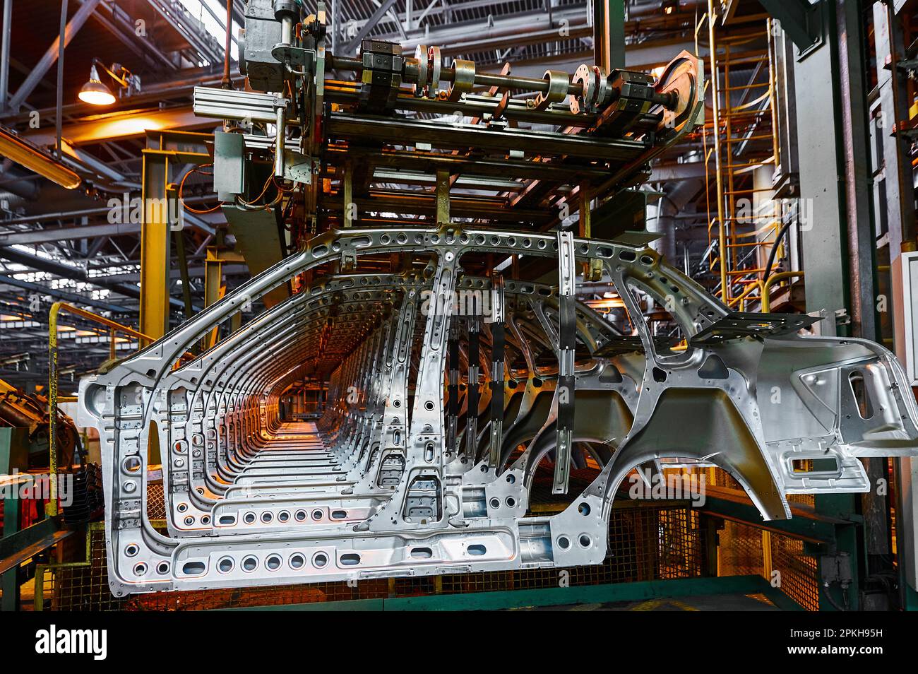 Passenger car carcass parts on assembling conveyor at plant Stock Photo ...