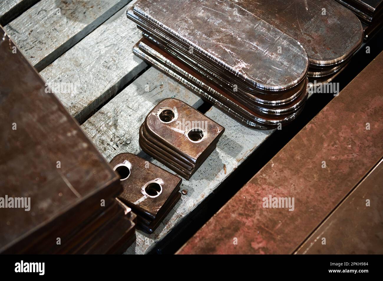 Group of workpieces cut of metal sheet in storehouse Stock Photo - Alamy