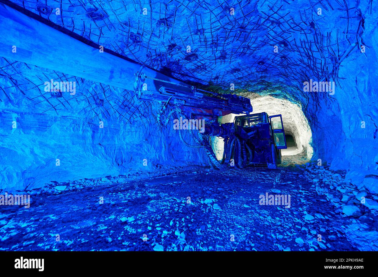 Mining drilling machine works in tunnel of salt quarry Stock Photo - Alamy