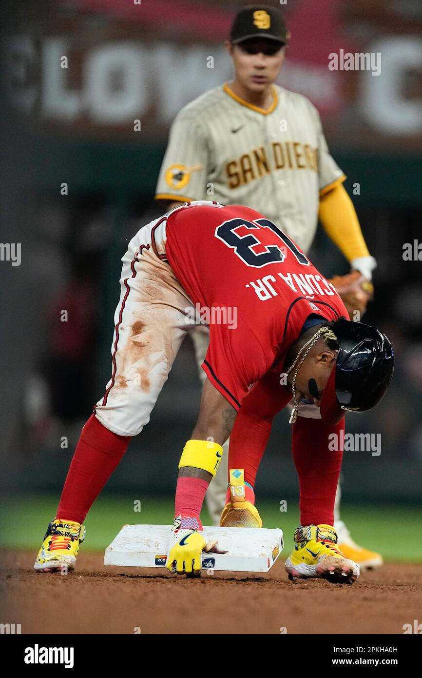 Atlanta Braves' Ronald Acuna Jr. (13) replaces the bag after stealing ...
