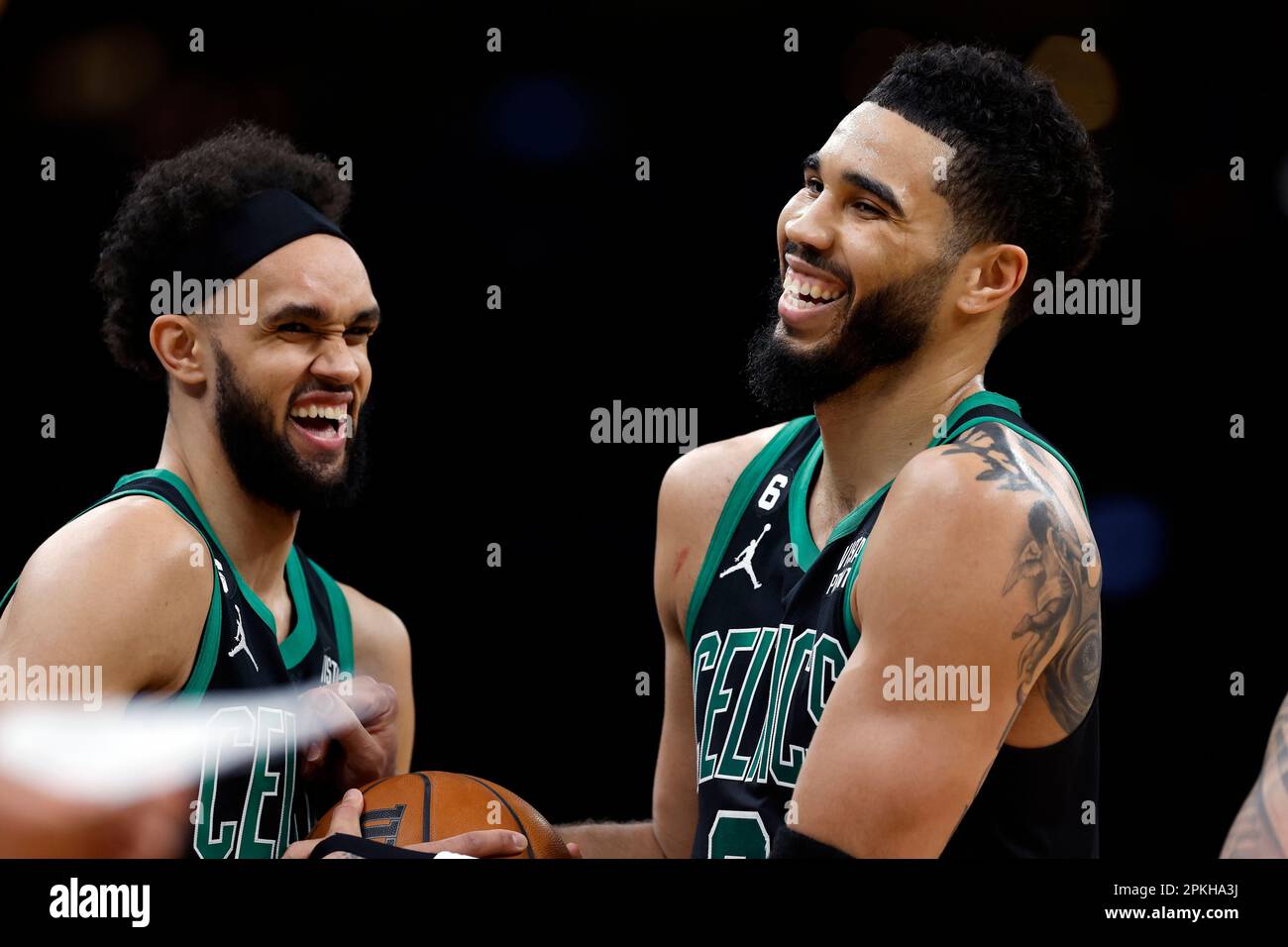 Boston Celtics' Jayson Tatum, right, and Derrick White react during the ...