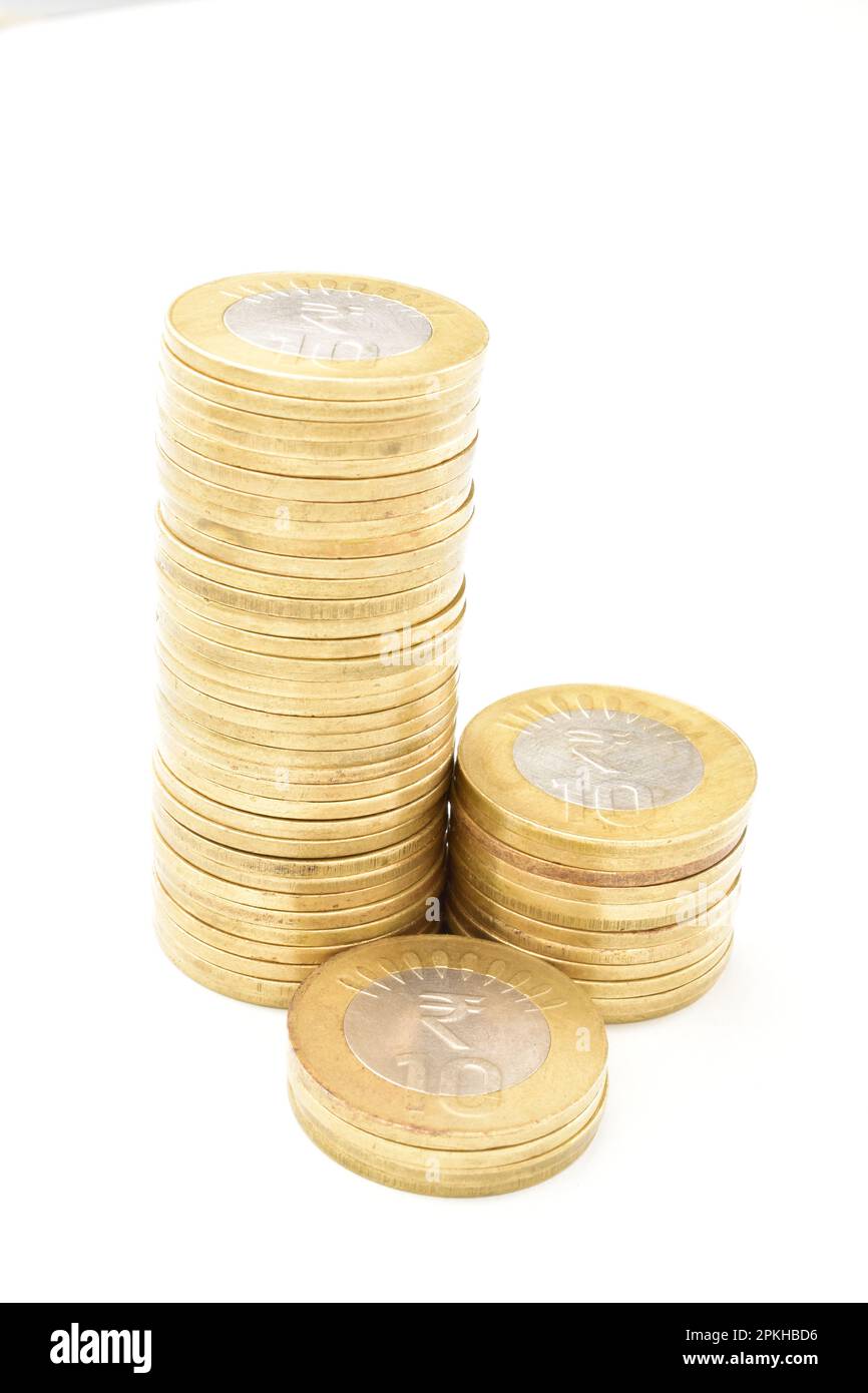 Indian coin stack isolated on white background Stock Photo - Alamy