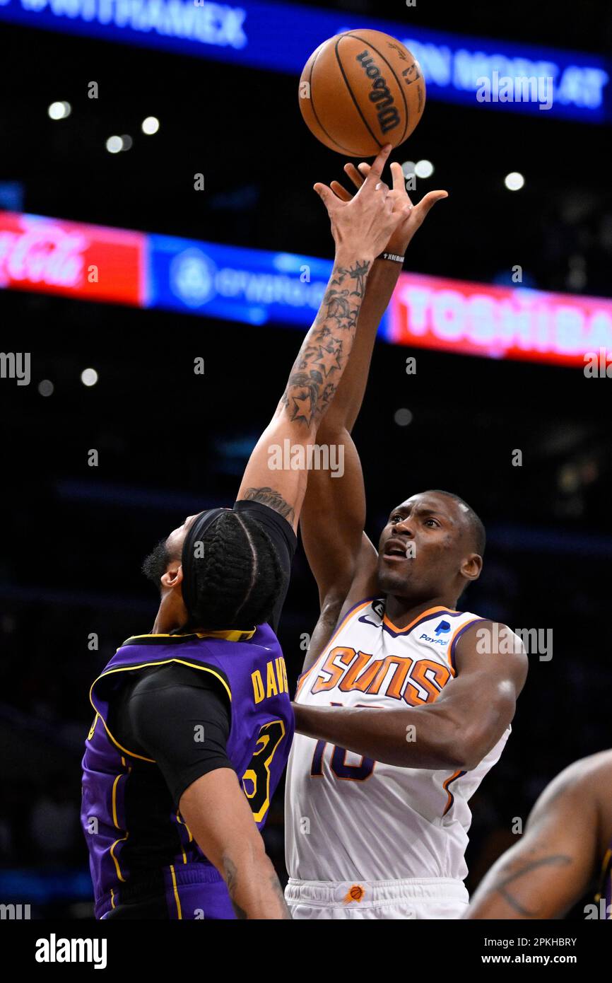 Phoenix Suns center Bismack Biyombo, right, shoots as Los Angeles ...