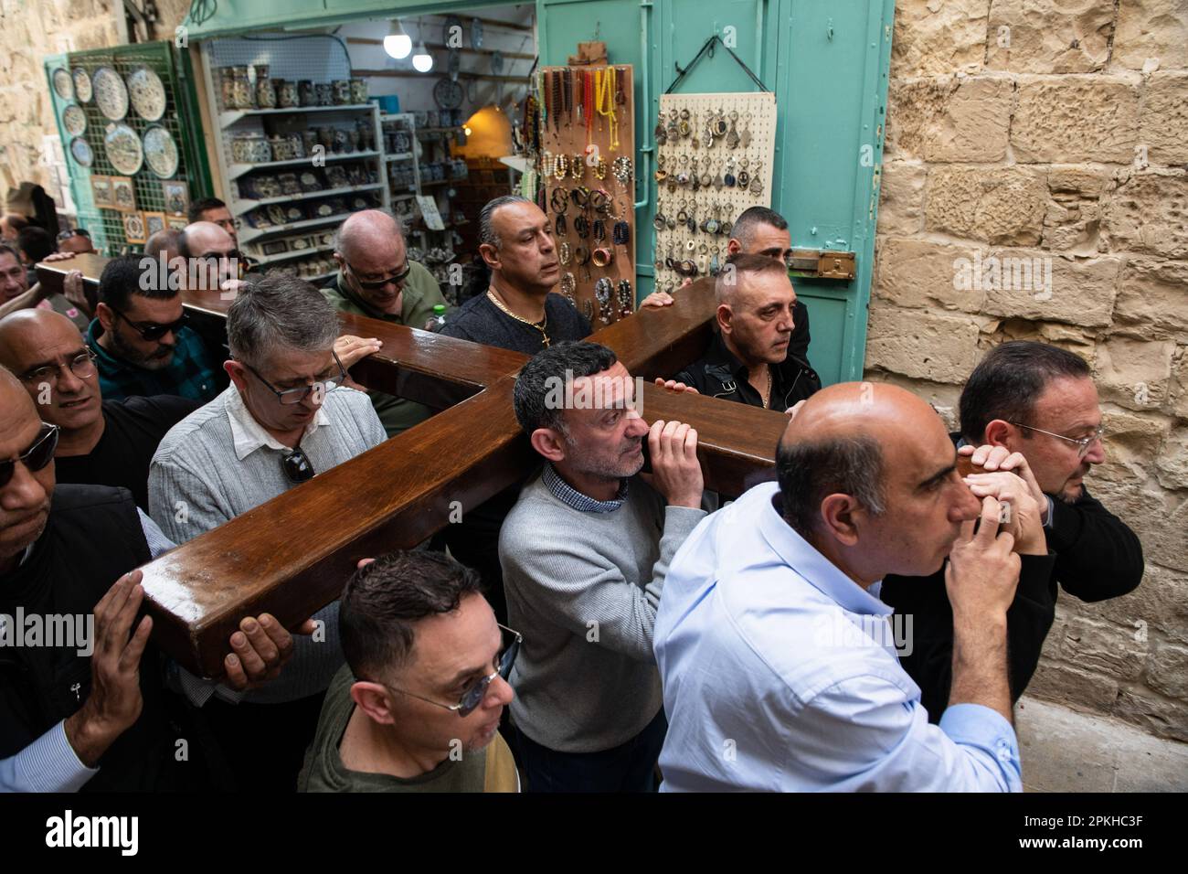 Jerusalem, Israel. 07th Apr, 2023. Christian pilgrims carry a fully ...