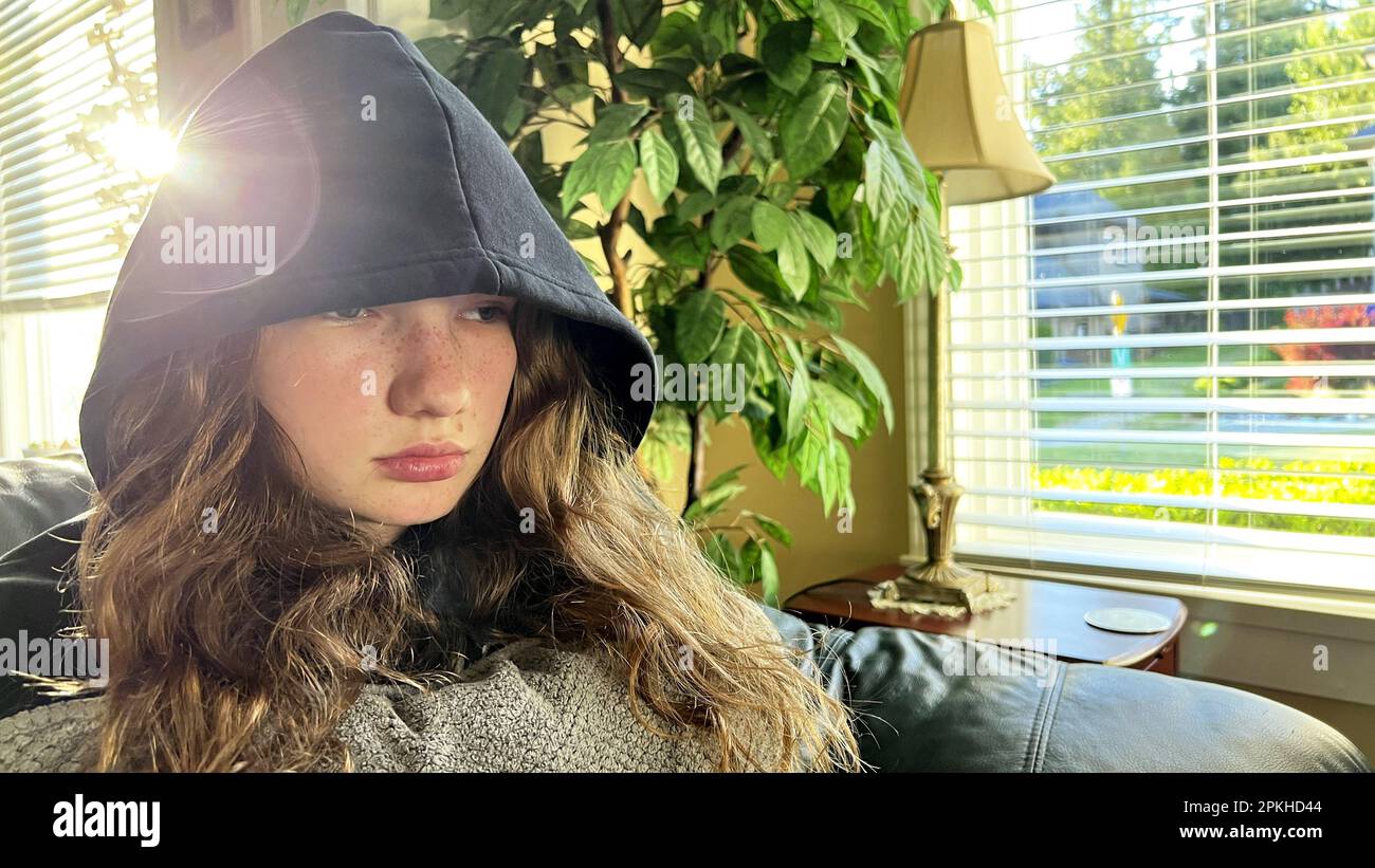 a teenage girl pulled a hood over her eyes she got angry, pressed a ...