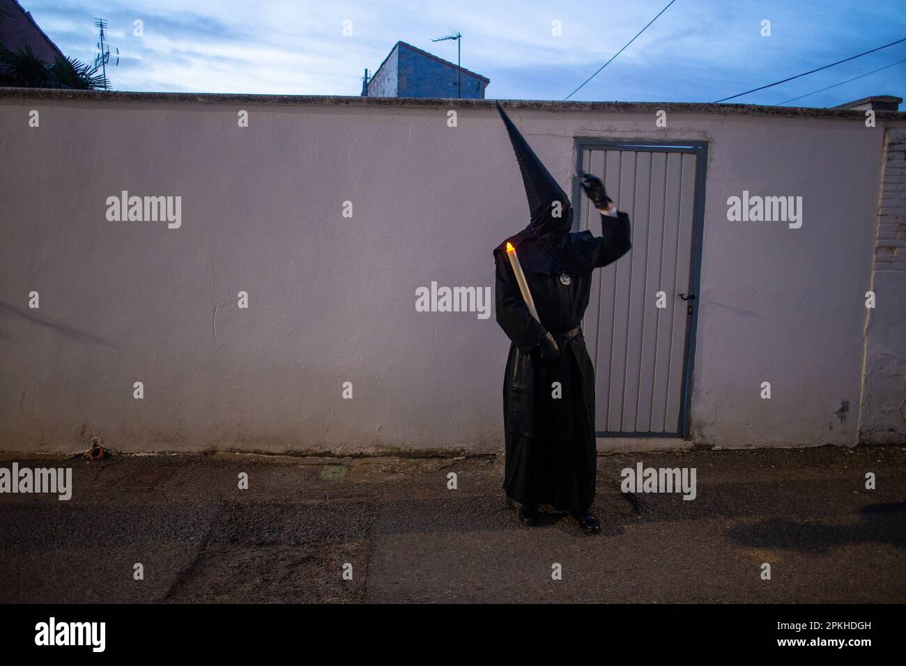 Sahagun, Spain. 07th Apr, 2023. A penitent with a led candle rests ...