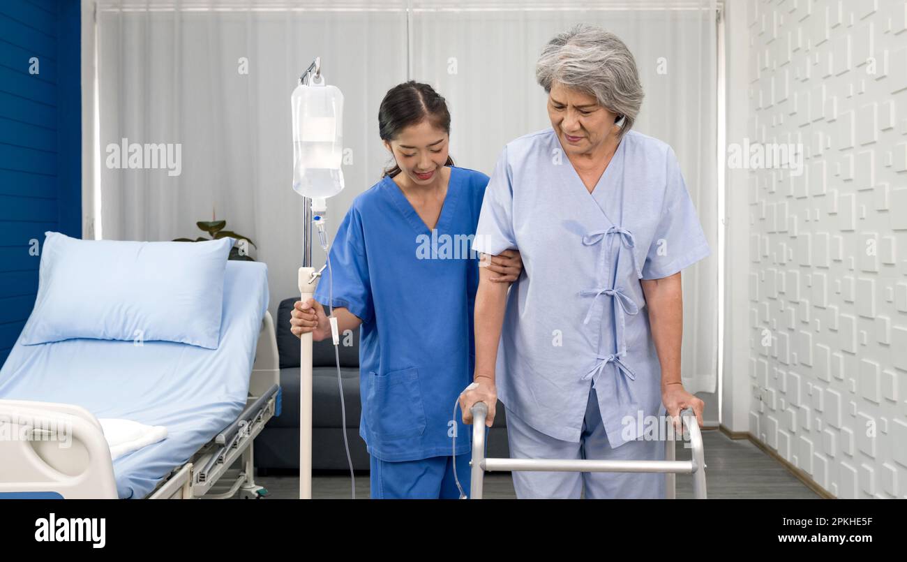 Caregiver doctor serve physical therapy for elderly patient to exercise ...