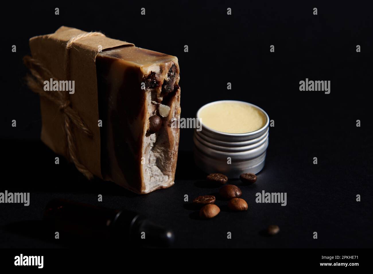 A bar with cold-pressed organic homemade soap with coffee beans and jar ...