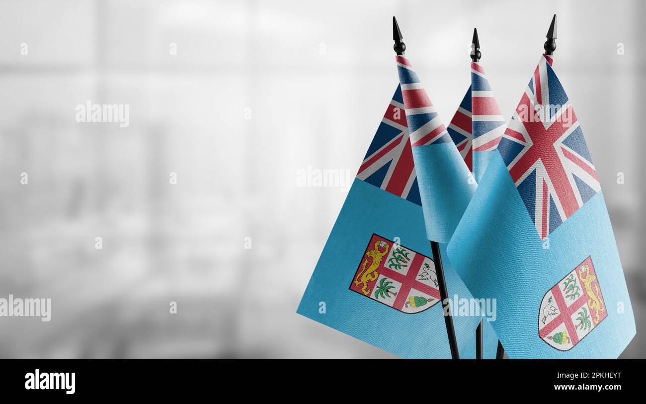 Small flags of the Fiji on an abstract blurry background Stock Photo ...