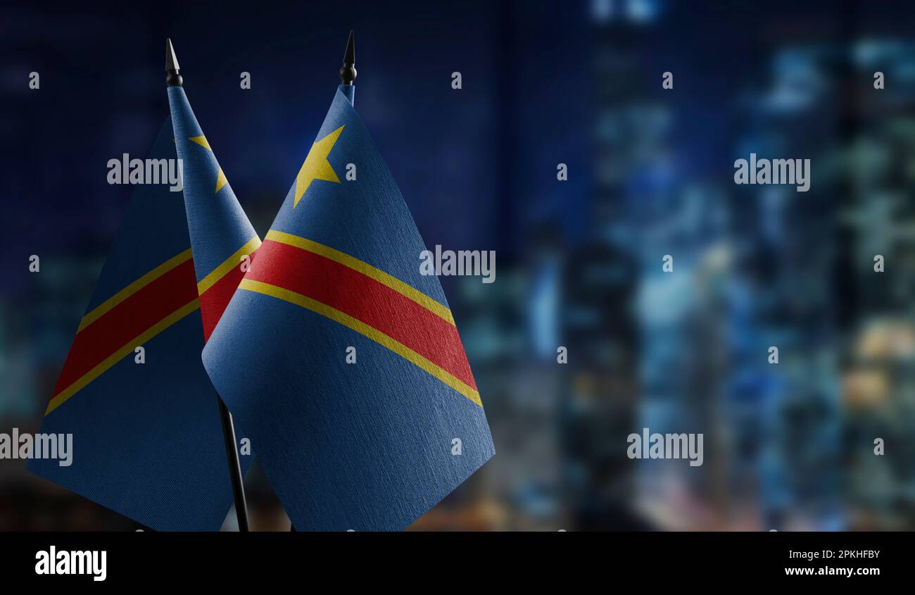 Small flags of the Democratic Republic of the Congo on an abstract ...