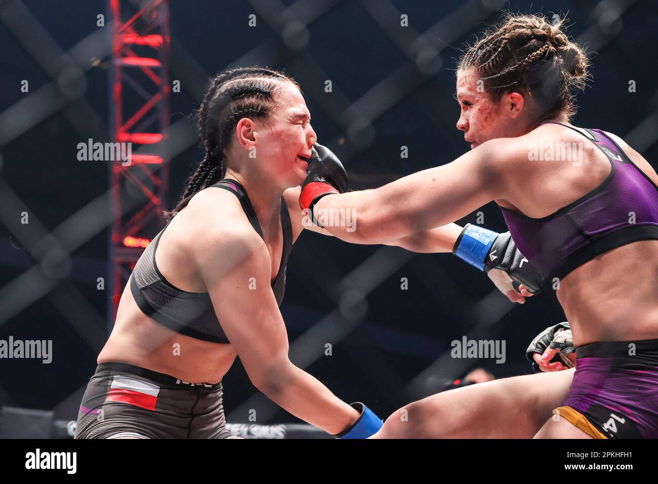 April 7, 2023: (R-L) Featherweight Evelyn Martins punches Karolina Sobek during their PFL 2 ...