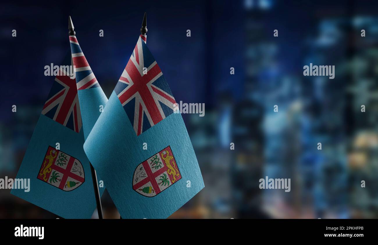 Small flags of the Fiji on an abstract blurry background Stock Photo ...